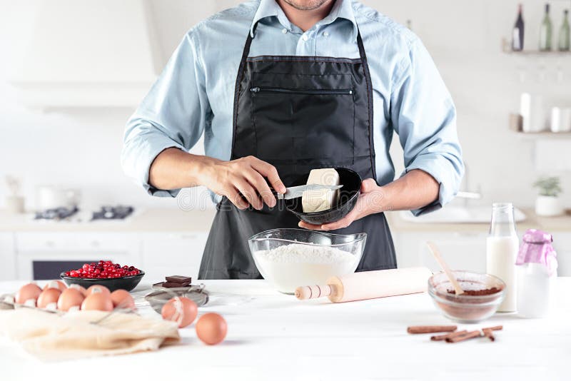 A Cook with Eggs on a Rustic Kitchen Against the Background of Men`s ...