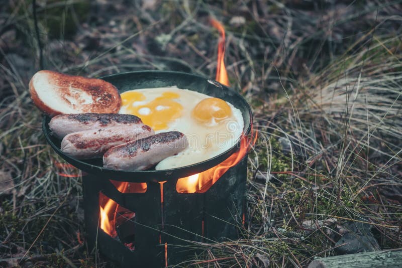 Cook on Fire while Hiking with a Backpack Stock Image - Image of burn ...