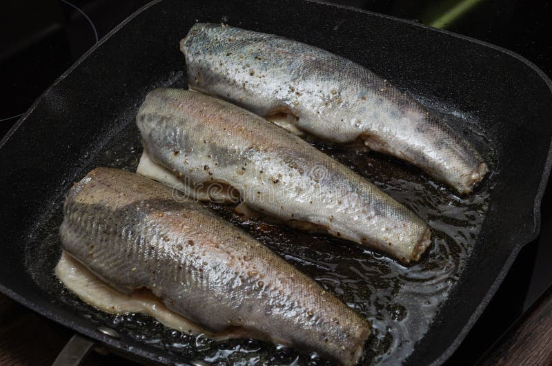 The Cook Fries Rainbow Trout Fish in a Pan Stock Photo - Image of ...
