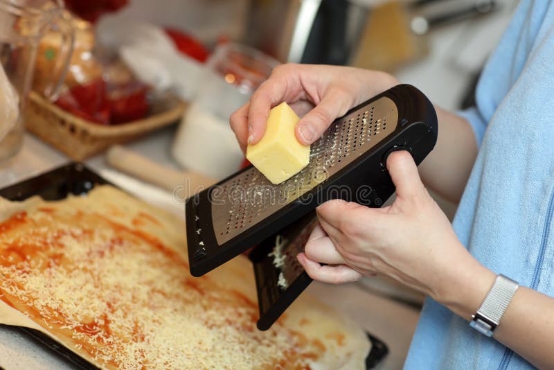 Cook grating cheese stock image. Image of kitchen, cutting - 38404953