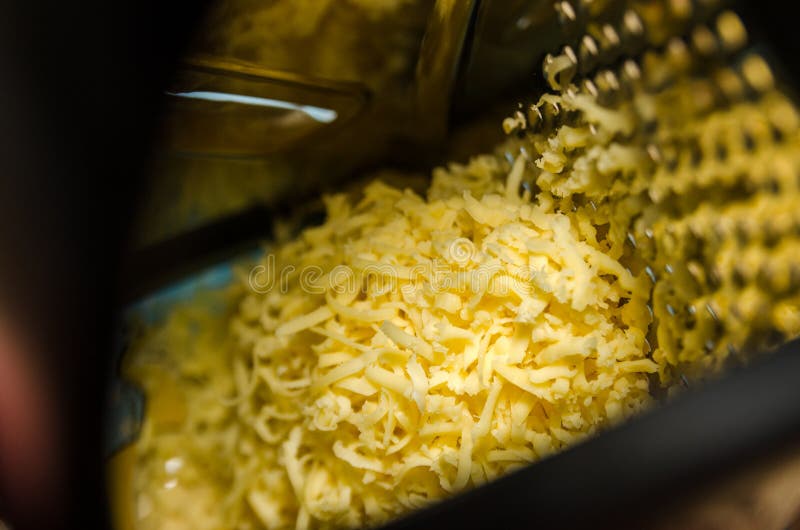 Iron grater with cheese stock photo. Image of nutrition - 143465204