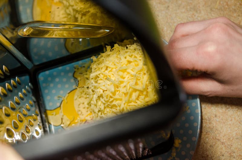 Iron grater with cheese stock image. Image of nutrition - 143501629