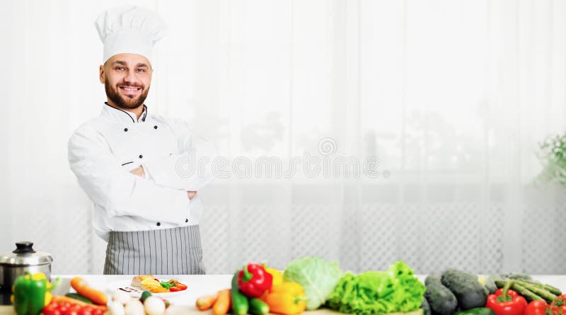 Cook Guy in Uniform Posing Crossing Hands in Restaurant Kitchen Stock ...