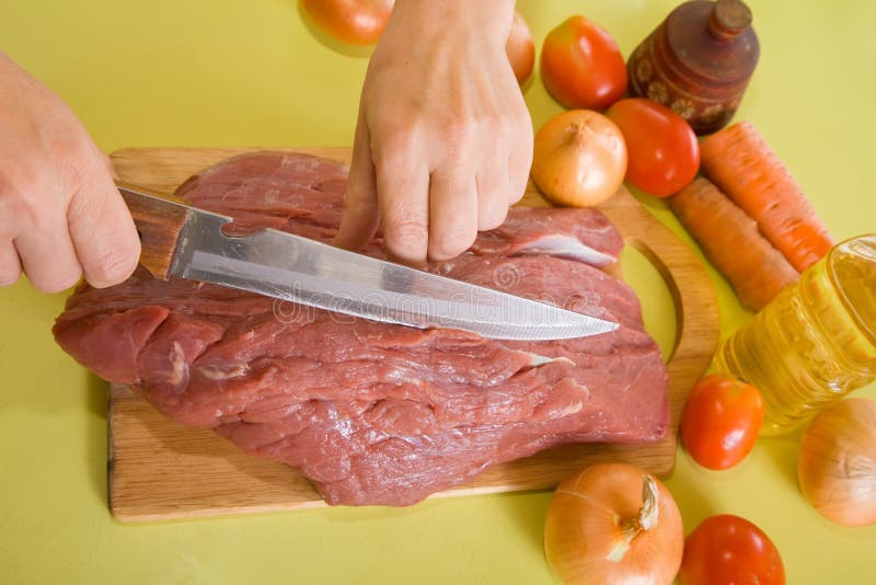 Cook hands cutting beef stock photo. Image of cook, knife - 18774900