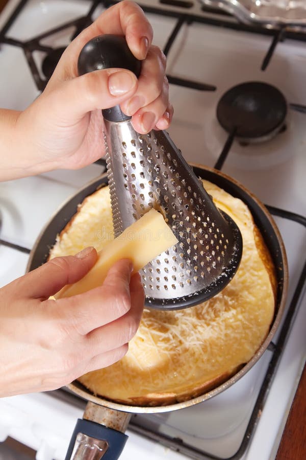 Cook Hands Grating Cheese into Omelet Stock Image - Image of heater ...