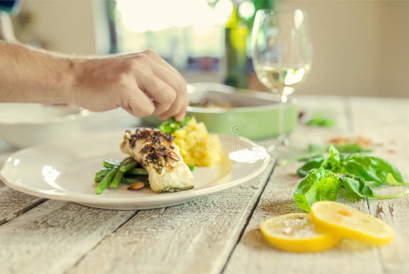 The Cook Has Prepared the Dishes and Decorates it. Stock Image - Image ...