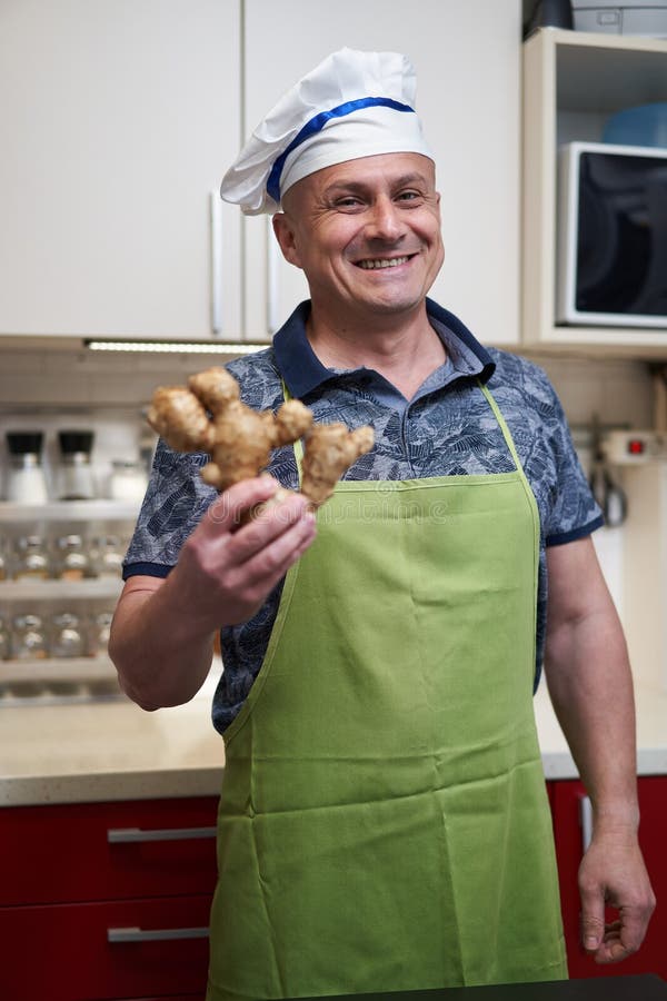 Cook Holding a Piece of Ginger Stock Photo - Image of male, preparing ...