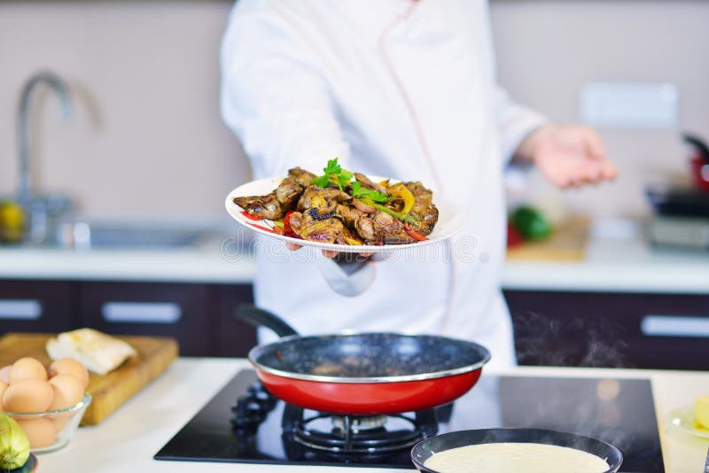 Cook Holding Plate with Food in Welcoming Gesture Stock Image - Image ...