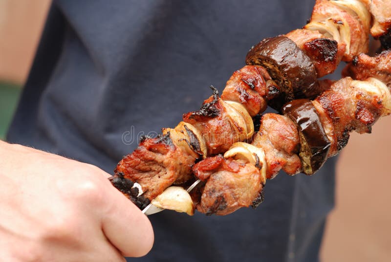 The Cook Holds the Prepared Meat in a Hand Stock Photo - Image of ...
