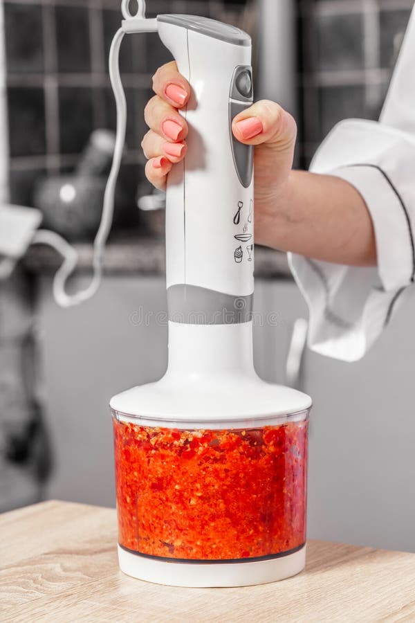 Cook Interrupts Pepper in a Blender Stock Photo - Image of herb ...