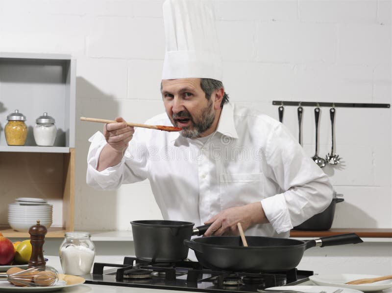 Cook in a kitchen stock photo. Image of simmer, careers - 9016930