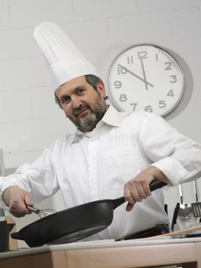 Cook in a kitchen stock photo. Image of sauces, food, cookout - 9017448