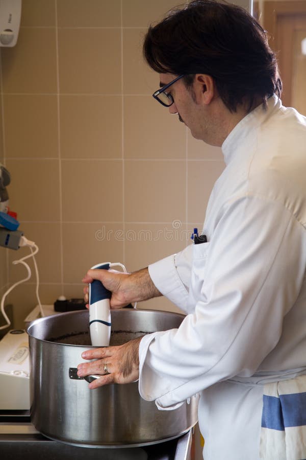 Cook in a kitchen stock image. Image of holding, person - 52164991