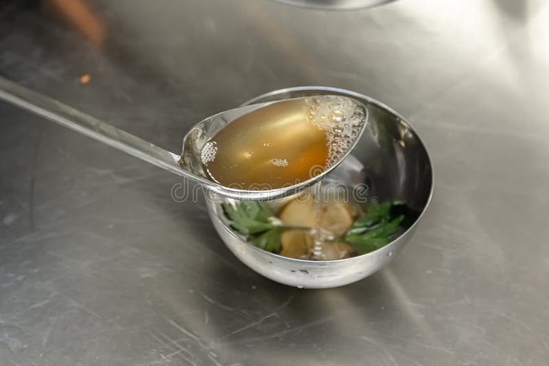 Cook with a Large Spoon Pour the Vegetables with Broth Stock Image ...
