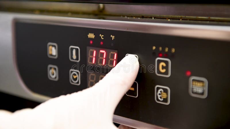 The Cook Makes a Temperature and Time Setting in an Electric Oven for ...