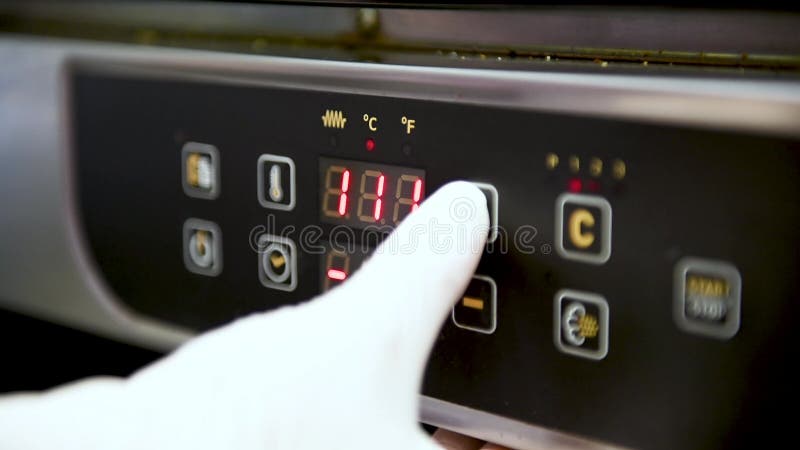 The Cook Makes a Temperature and Time Setting in an Electric Oven for ...
