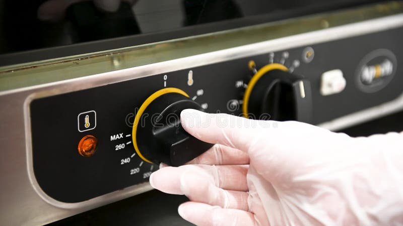 The Cook Makes a Temperature and Time Setting in an Electric Oven for ...
