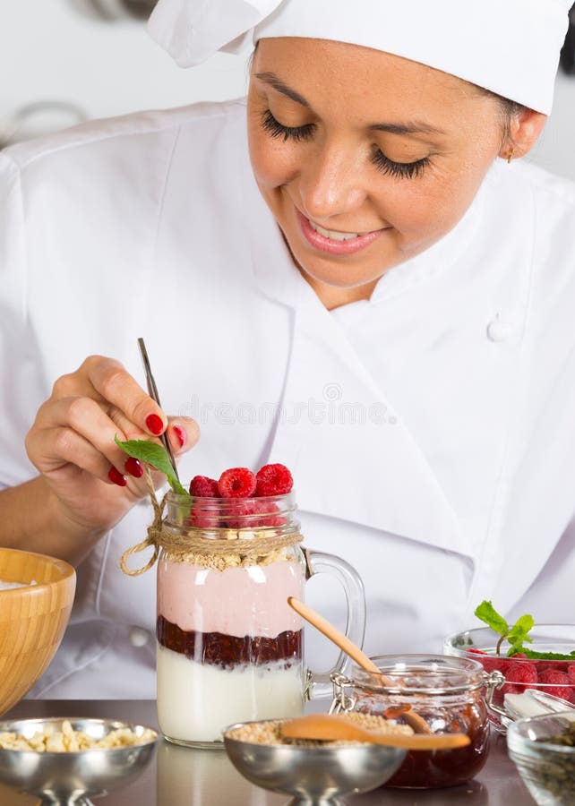Cook making a dessert stock image. Image of attractive - 101411903