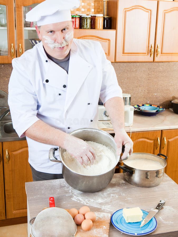 Cook man in kitchen stock photo. Image of preparation - 12326322