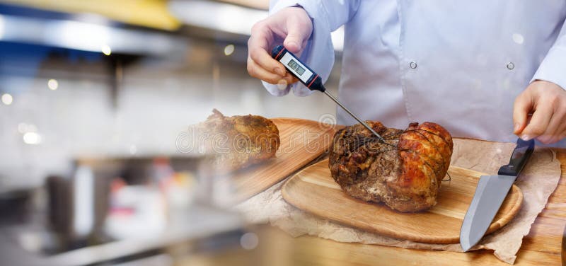 Cook Measuring Temperature of Cooked Meat on Table Stock Photo - Image ...