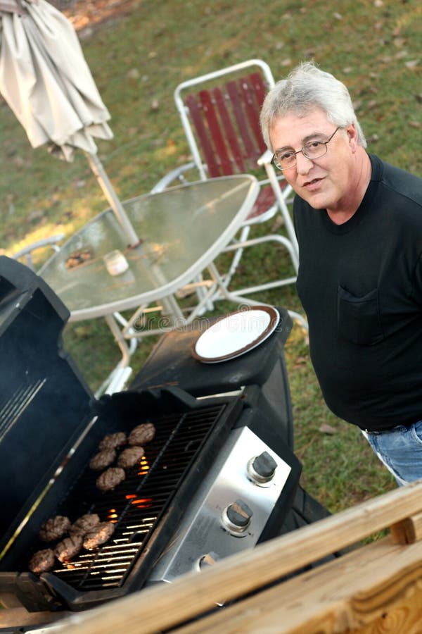 Family Having Burgers Off the Grill Stock Image - Image of beach, copy ...
