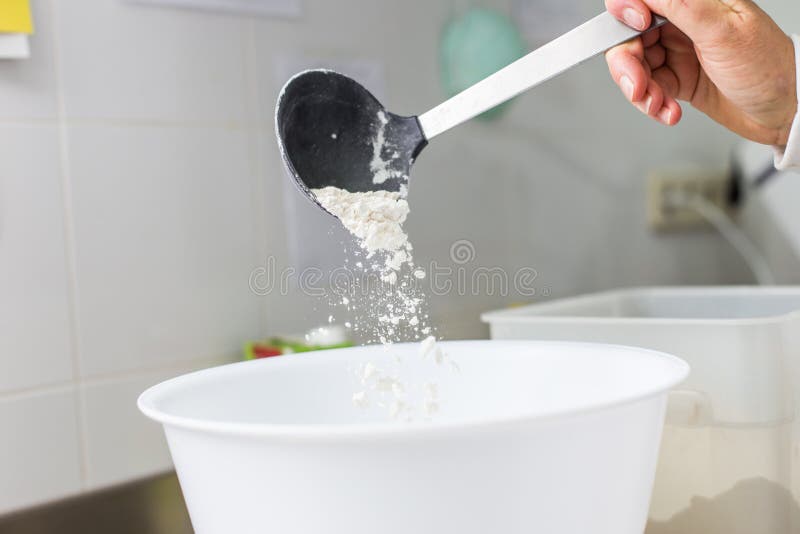 Cook pouring flour stock image. Image of baking, heap - 67643067