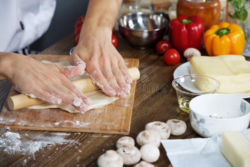 Cook prepare pizza dough stock photo. Image of dessert - 54313148