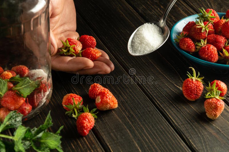 Cook Prepares Fruit Drink from Fresh Strawberries and Mint on the ...