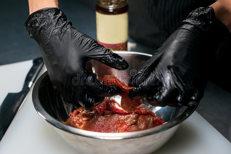 Cook Prepares Meat in Marinade in a Plate Stock Photo - Image of knead ...