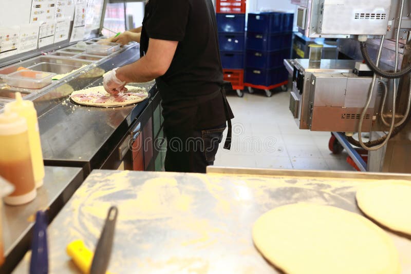 Cook Prepares Pizza for Baking Stock Photo - Image of fast, bake: 176031798