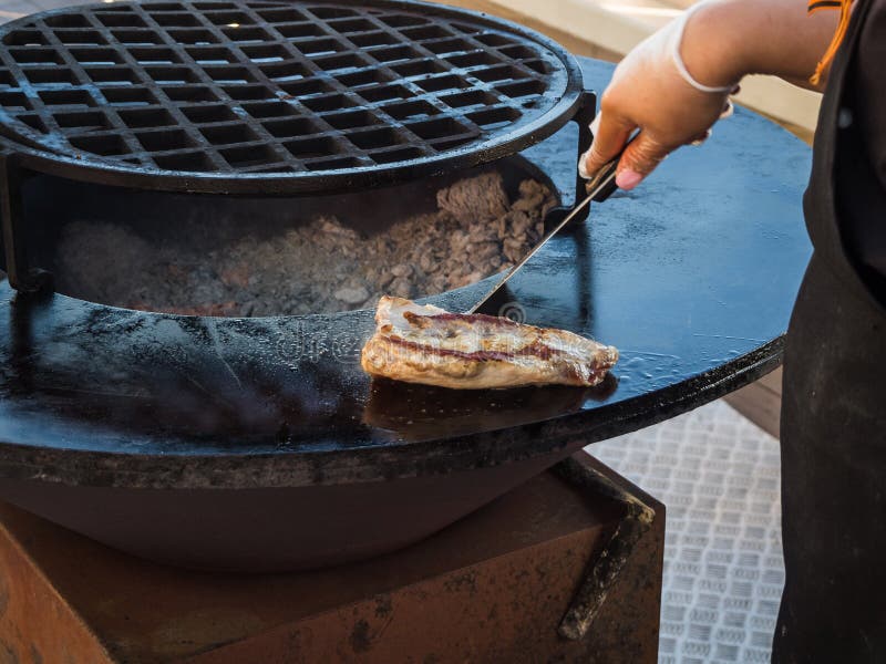 Cook Prepares Ribs on a Circular Grill in Sochi Stock Image - Image of ...