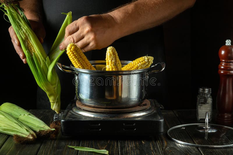 Cook Preparing Corn for Lunch at Hotel. Chef Cleaning Head of Raw Maize ...