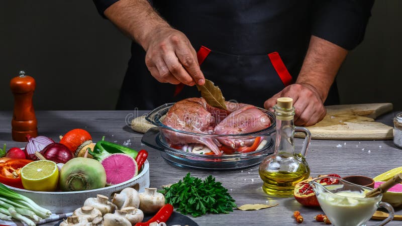 Cook Preparing Delicious Rabbit Meat with Herbs. Concept Cooking Recipe ...