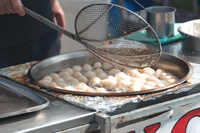 Cook is Preparing a Loukoumades Dough Balls in Boiling Oil. Cyprus ...