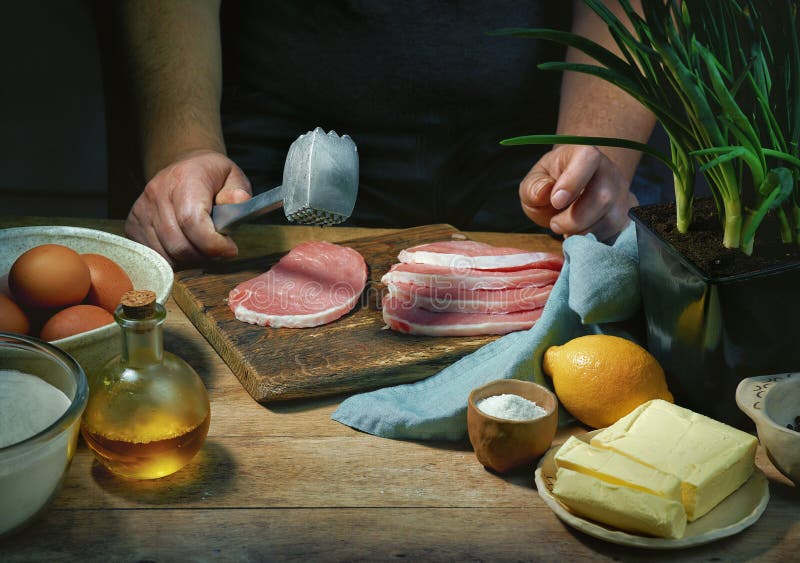 Cook is preparing meat stock image. Image of food, male - 111241545