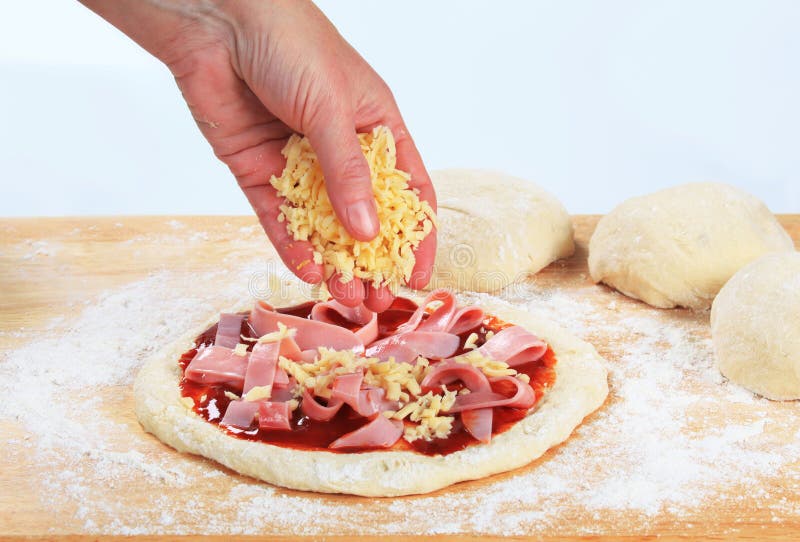 Cook preparing pizza stock image. Image of hand, tomato - 31201803