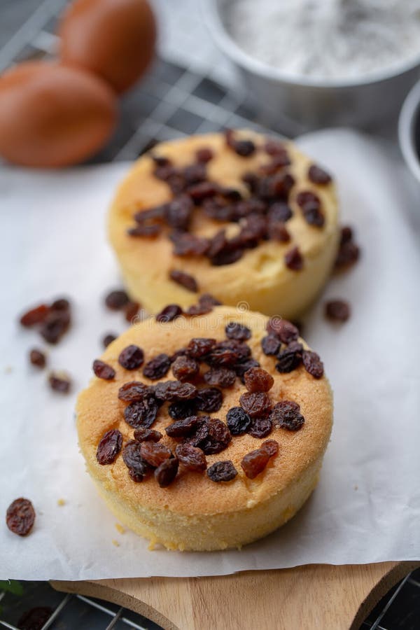 Cook Preparing a Sweet Cake Topping with Raisin on it Stock Image ...