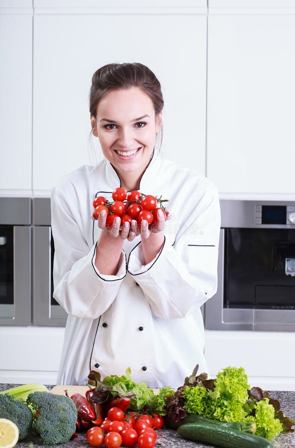 Cook shows small tomatoes stock photo. Image of delicious - 42085778