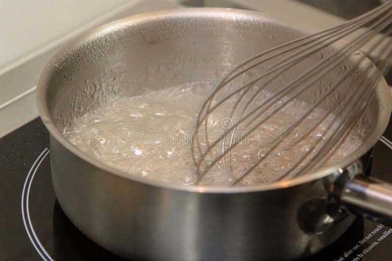 The Cook Stirs the Boiling Broth with a Whisk Stock Photo - Image of ...