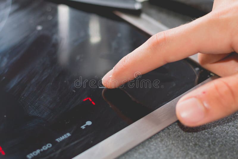 Cook is Switching on the Induction Cooktops Stock Photo - Image of ...