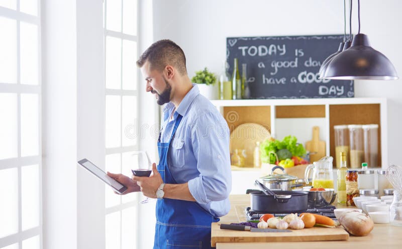 Cook with a Tablet in Hand and Studying the Recipe Stock Photo - Image ...