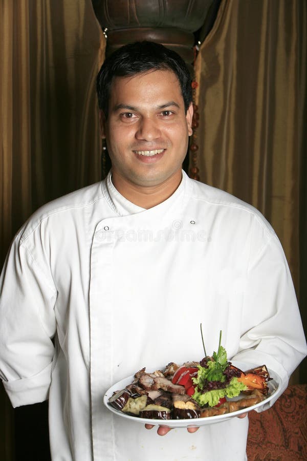 Cook Takes Off The Fried Meat And Green-stuffs Stock Image - Image of ...