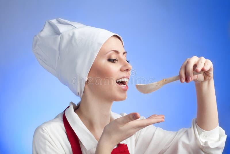 Cook Tasting Using Wood Spoon Stock Photo - Image of female, beautiful ...