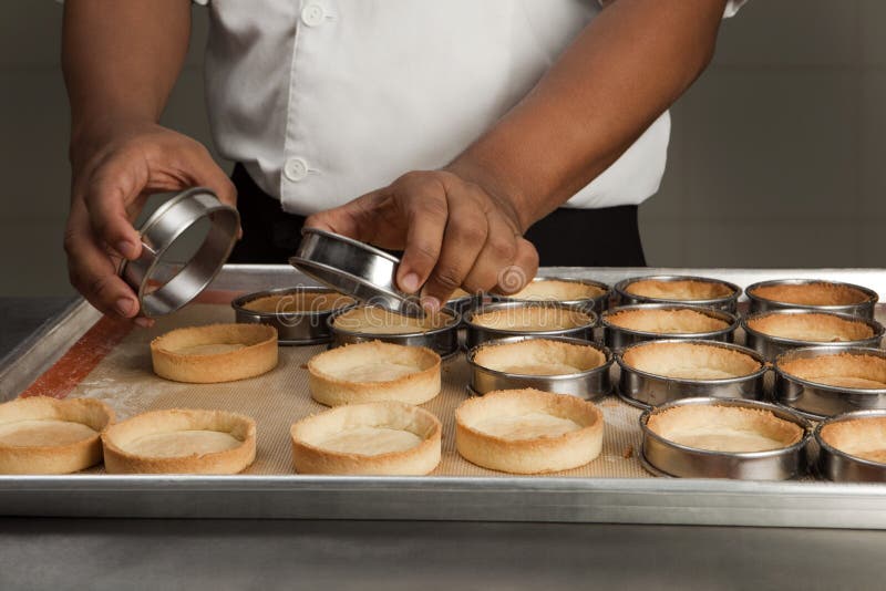 Cook Turning Out the Tartlet Bases Stock Photo - Image of pastry ...