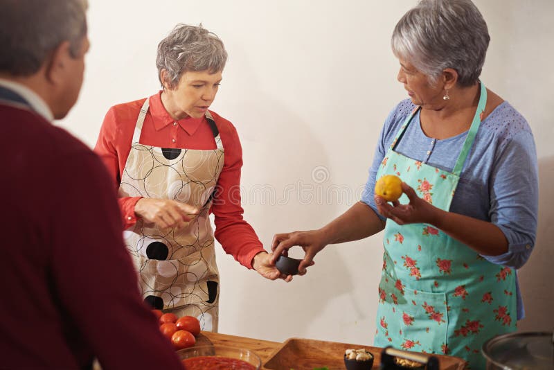 Cook Up Some Love. a Group of Seniors Cooking in the Kitchen. Stock ...
