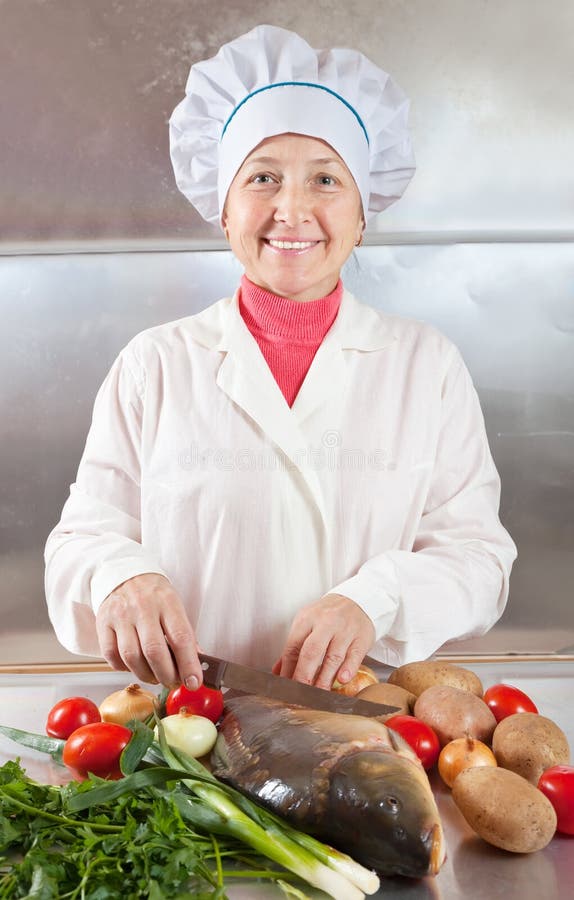 Cook woman with carp fish stock photo. Image of caucasian - 40811552