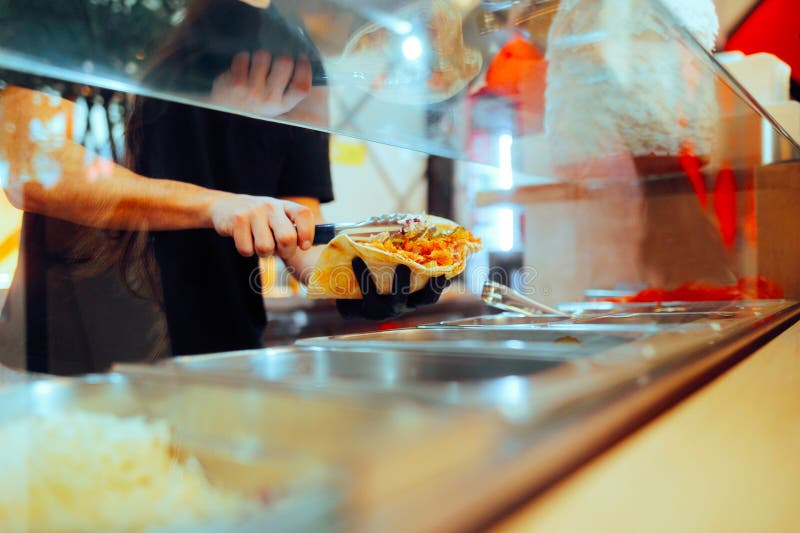 Fast Food Worker Assembling a Flat Bread Sandwich in a Restaurant Stock ...