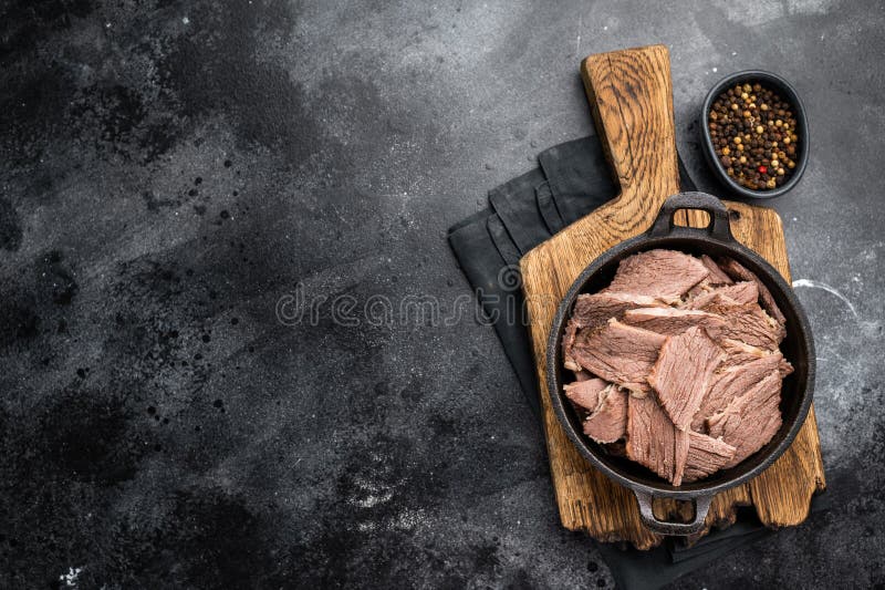 Cooked Boiled Lamb Meat in a Skillet. Black Background Stock Image ...