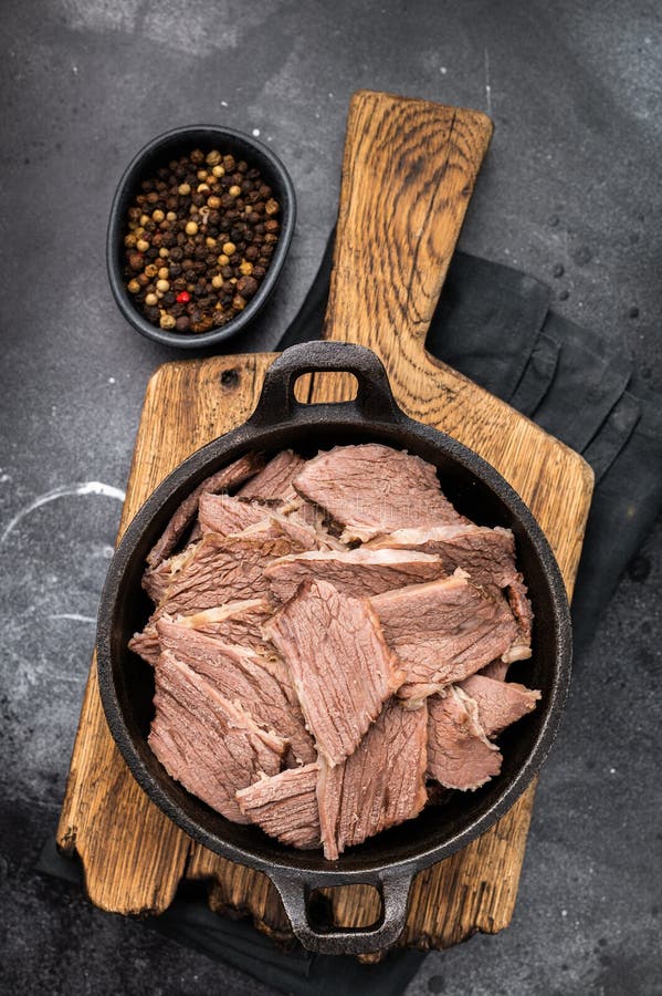 Cooked Boiled Lamb Meat in a Skillet. Black Background Stock Photo ...