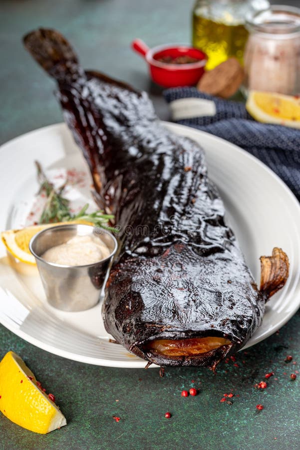 Cooked Catfish on Fire in a White Plate Stock Image - Image of ...